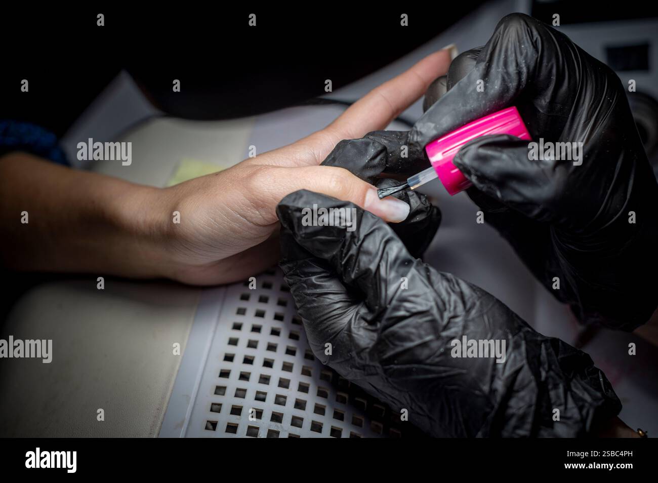 Gel manicure, long, sharp nails with a modern design, done by a ...