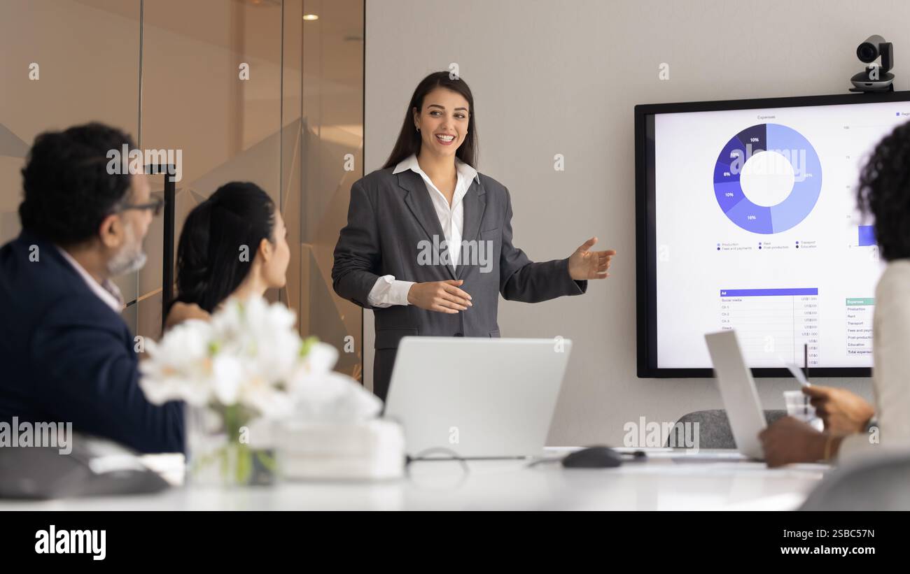 Happy successful young project manager woman presenting analytic data ...