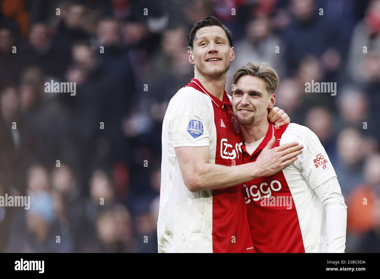AMSTERDAM - (l-r) Wout Weghorst of Ajax, Kenneth Taylor of Ajax celebrate victory during the ...