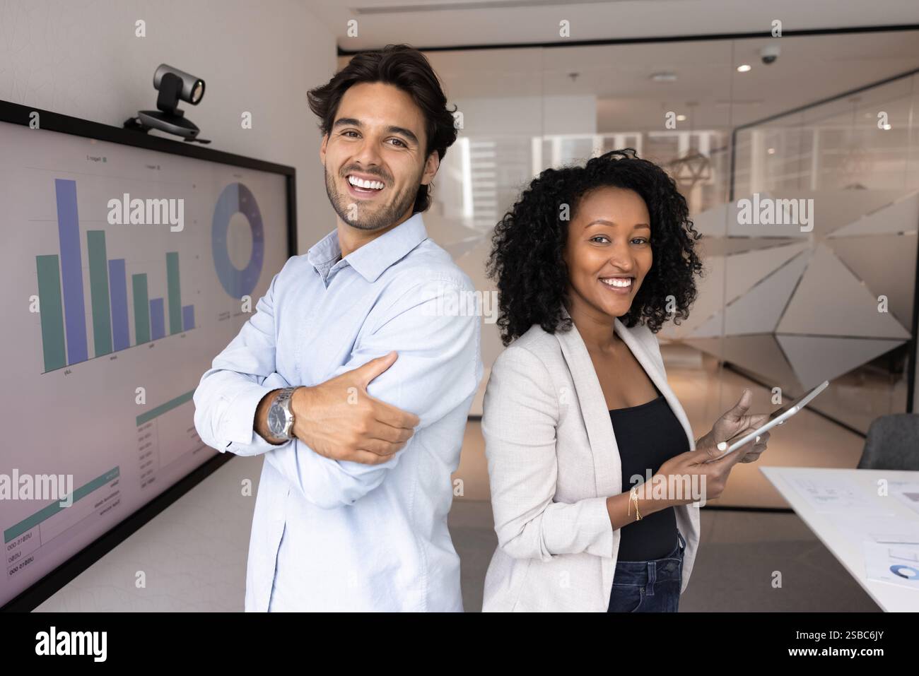Two happy diverse business partners posing for portrait Stock Photo - Alamy