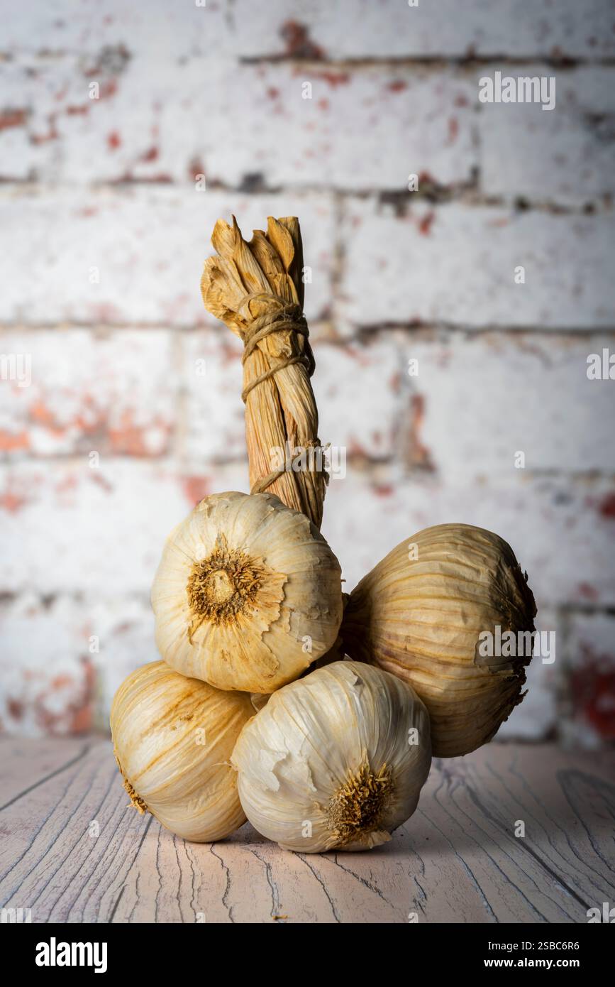 A garlic grappe is a beautifully bundled arrangement of garlic bulbs ...