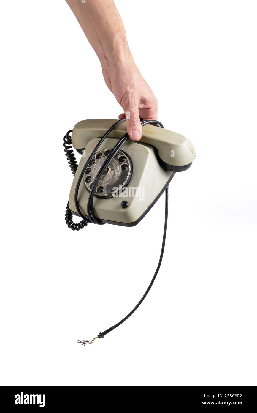 Old telephone in hand isolated on white background Stock Photo - Alamy