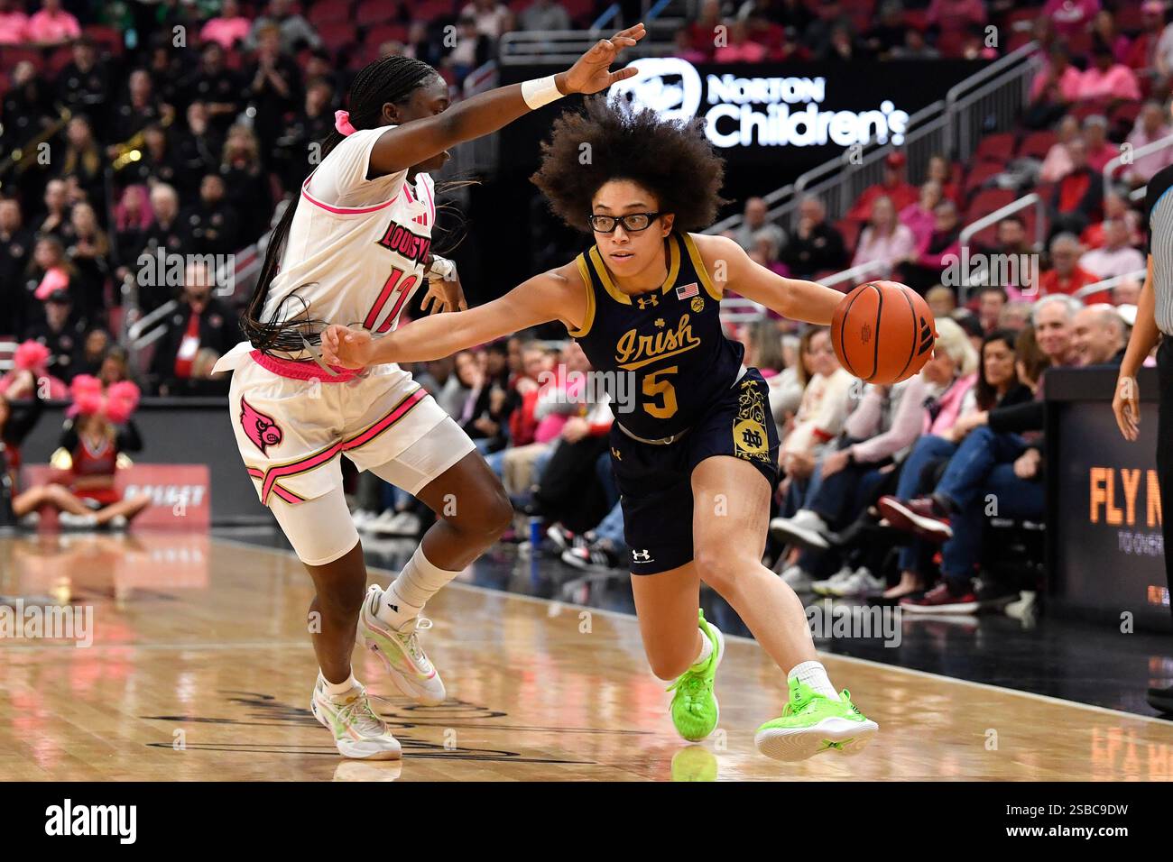 Notre Dame guard Olivia Miles (5) fights her way past Louisville guard ...