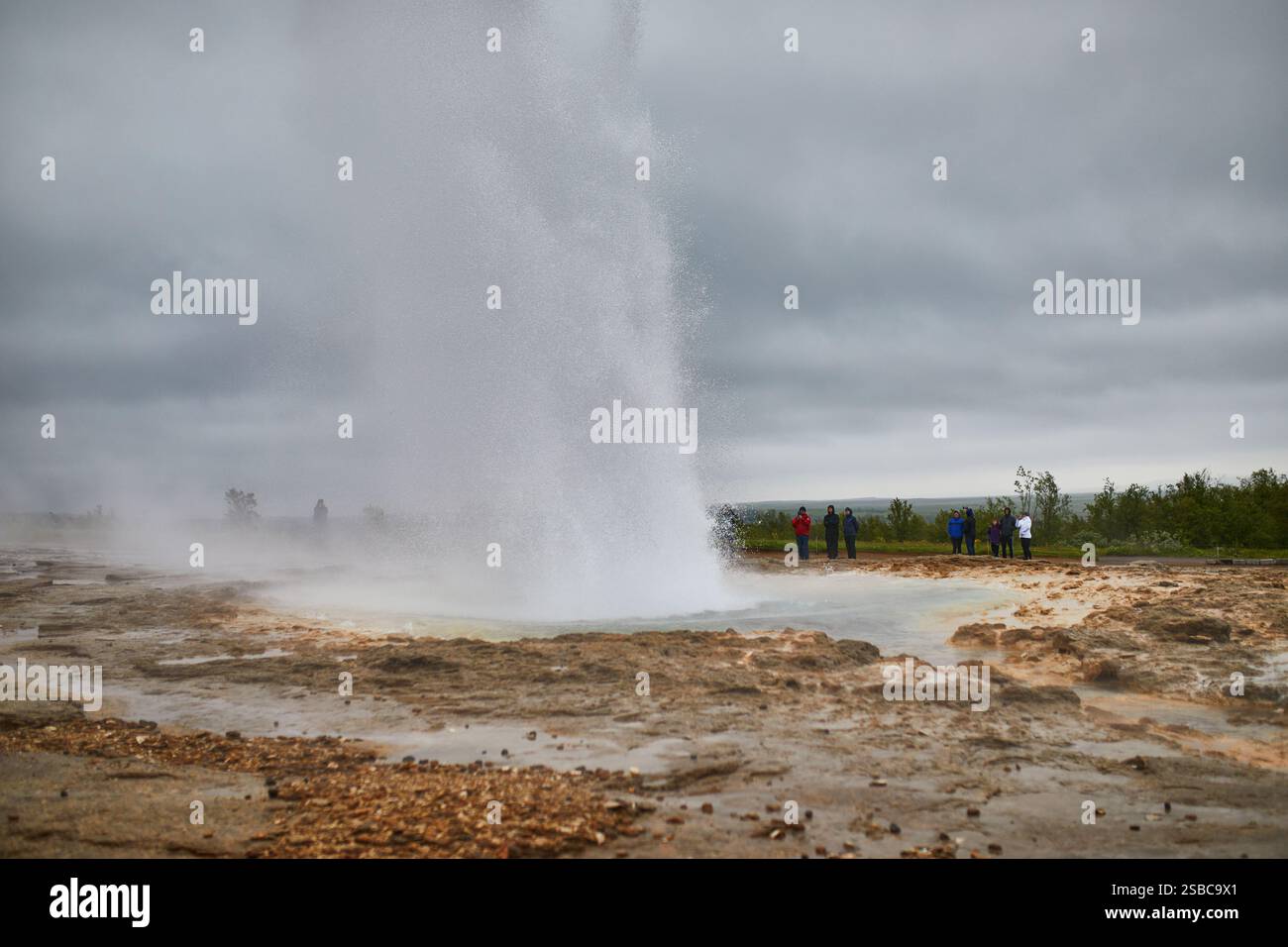 Famous Strokkur geyser erupting on a foggy rainy day in Iceland Stock ...