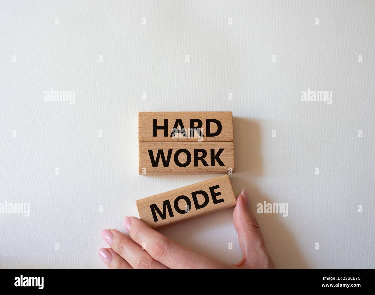 Hard Work Mode symbol. Concept word Hard Work Mode on wooden blocks ...