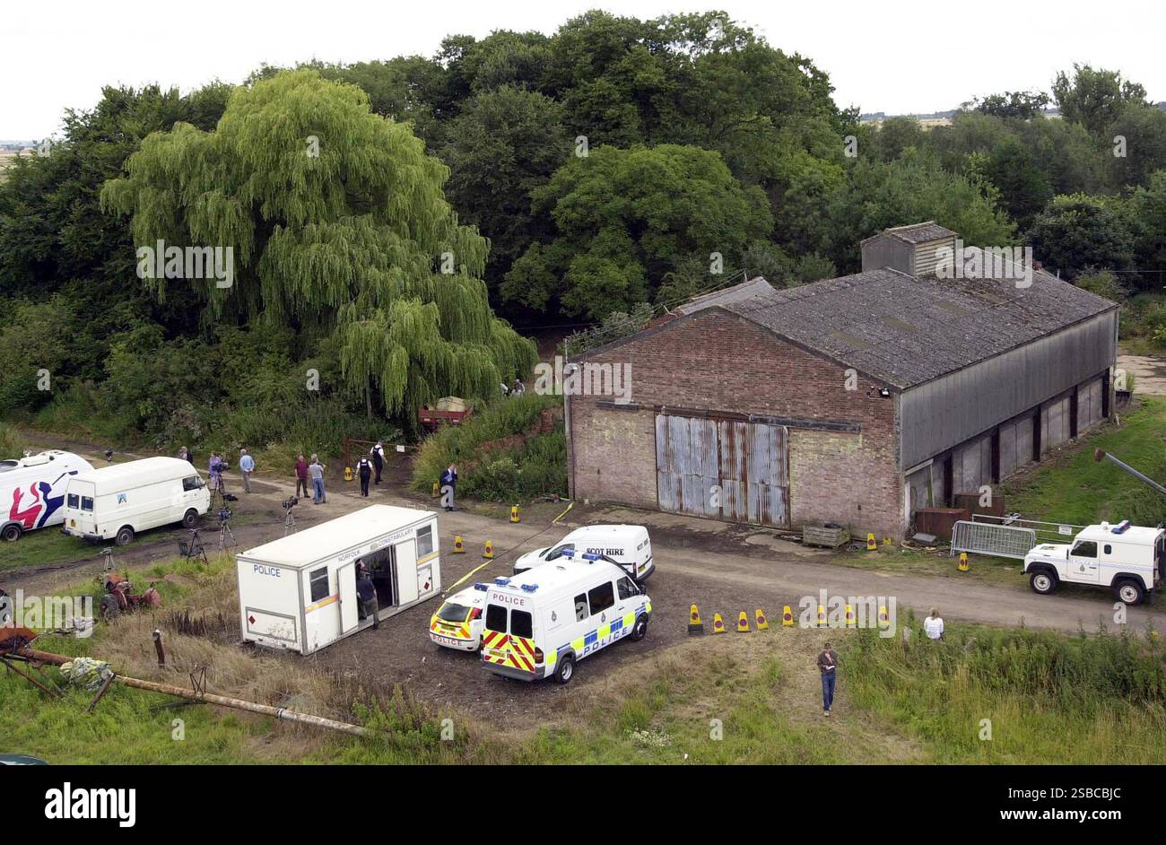 File photo dated 28/07/03 of police and media surrounding the grounds ...