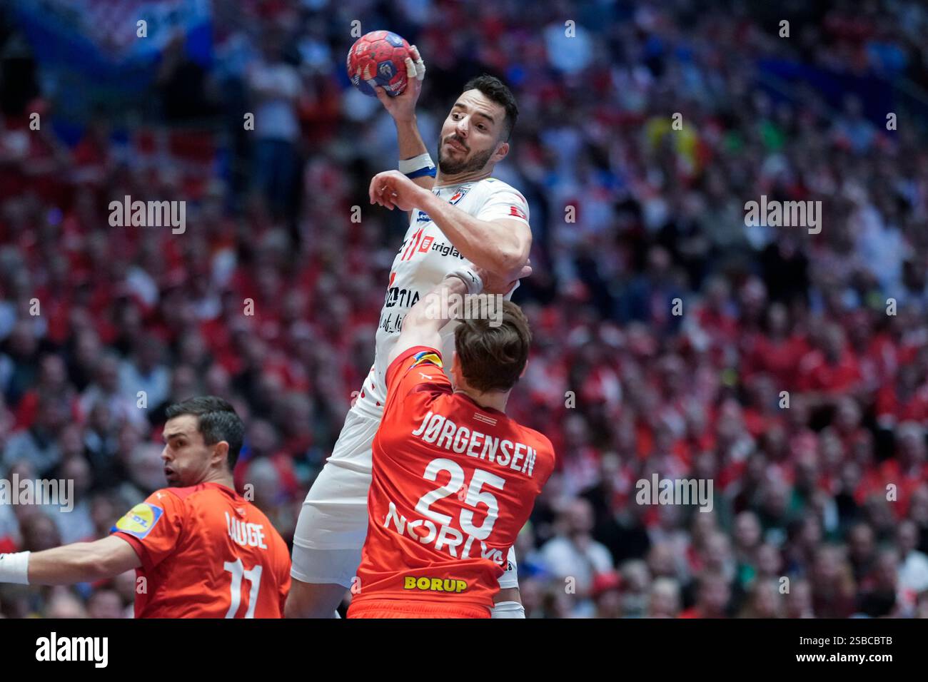 Croatia's Zvonimir Srna shoots over Denmark's Lukas Lindhard Jorgensen ...