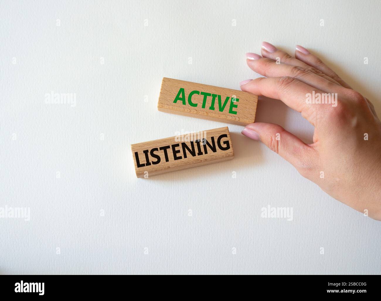 Active listening symbol. Wooden blocks with words Active listening ...