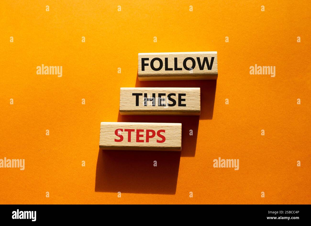 Follow these steps symbol. Wooden blocks with words Follow these steps ...