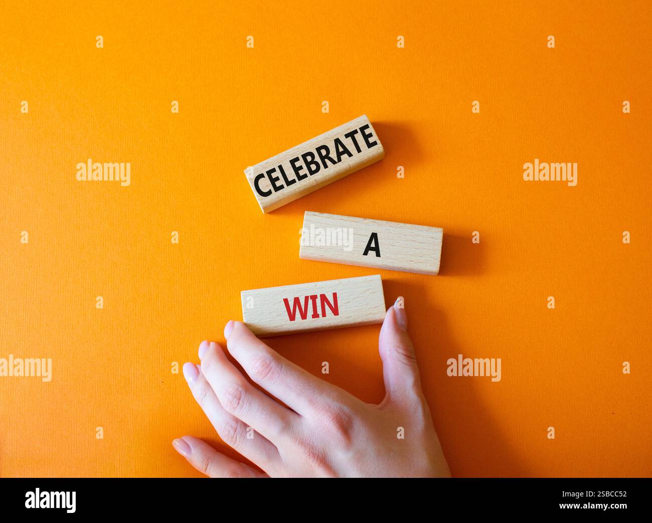 Celebrate a win symbol. Concept words Celebrate a win on wooden blocks ...