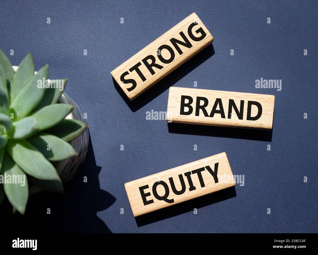 Strong Brand Equity symbol. Concept words Strong Brand Equity on wooden ...