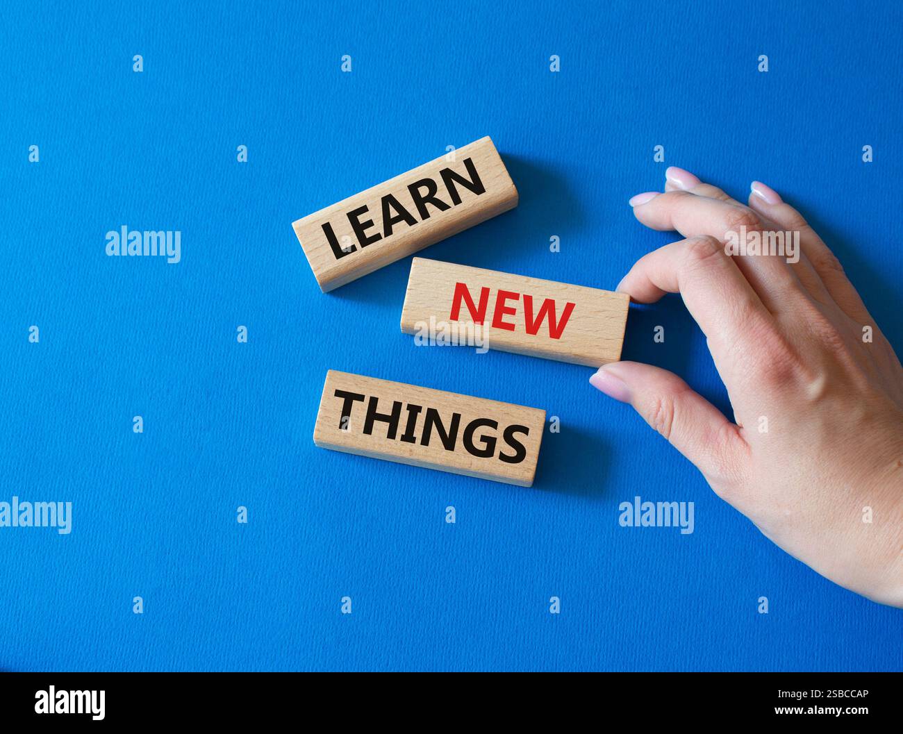 Learn new things symbol. Concept words Learn new things on wooden ...