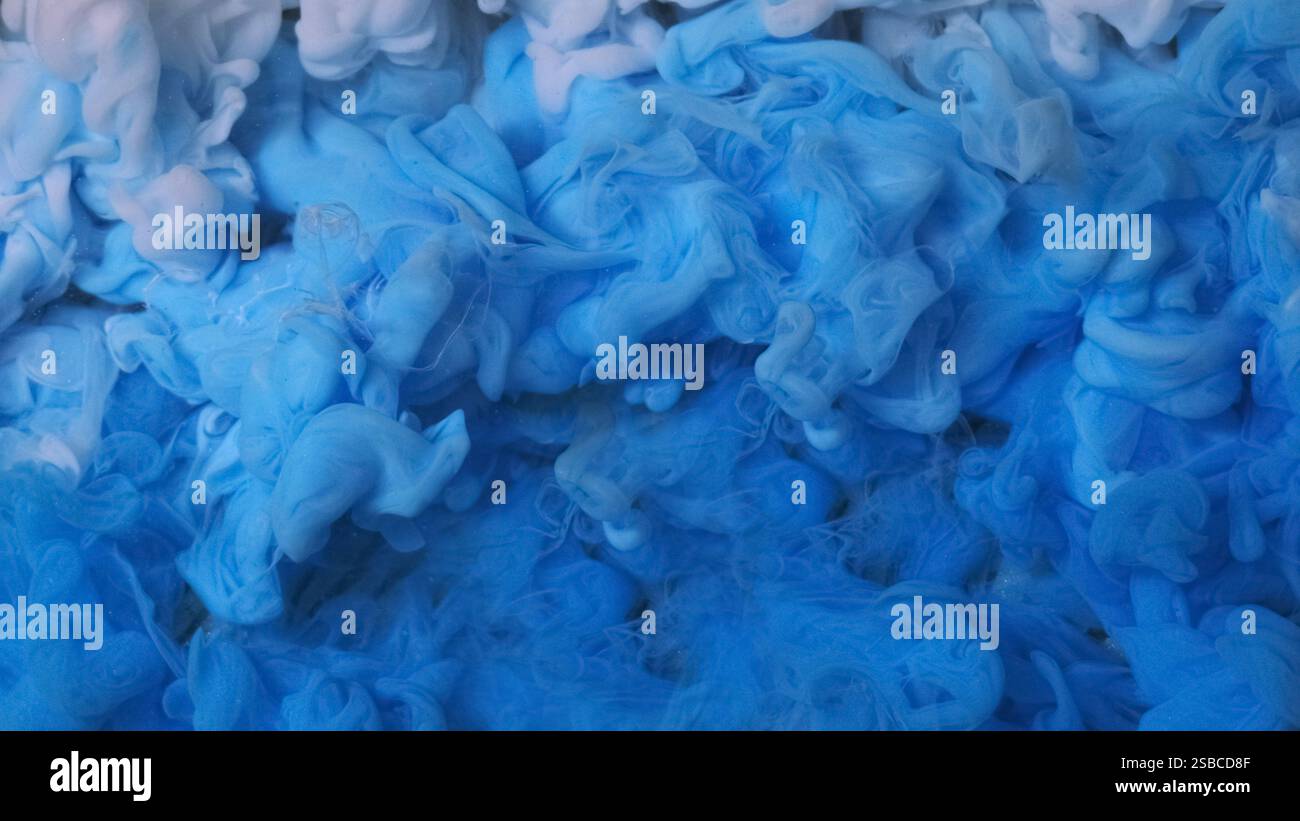 Abstract liquid paint. Color ink. Defocused blue smoke cloud splash ...