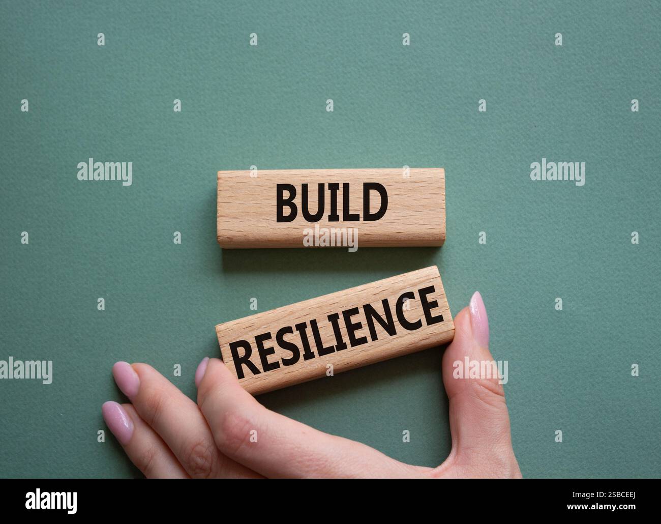 Build resilience symbol. Wooden blocks with words Build resilience ...