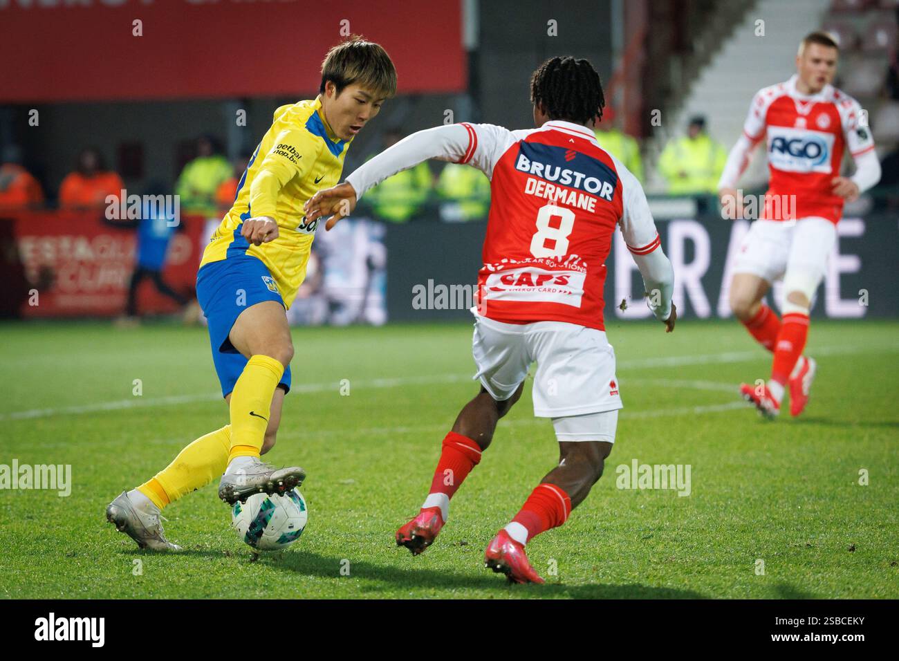Kortrijk, Belgium. 02nd Feb, 2025. Westerlo's Alfie Devine and Kortrijk's Karim Dermane fight ...