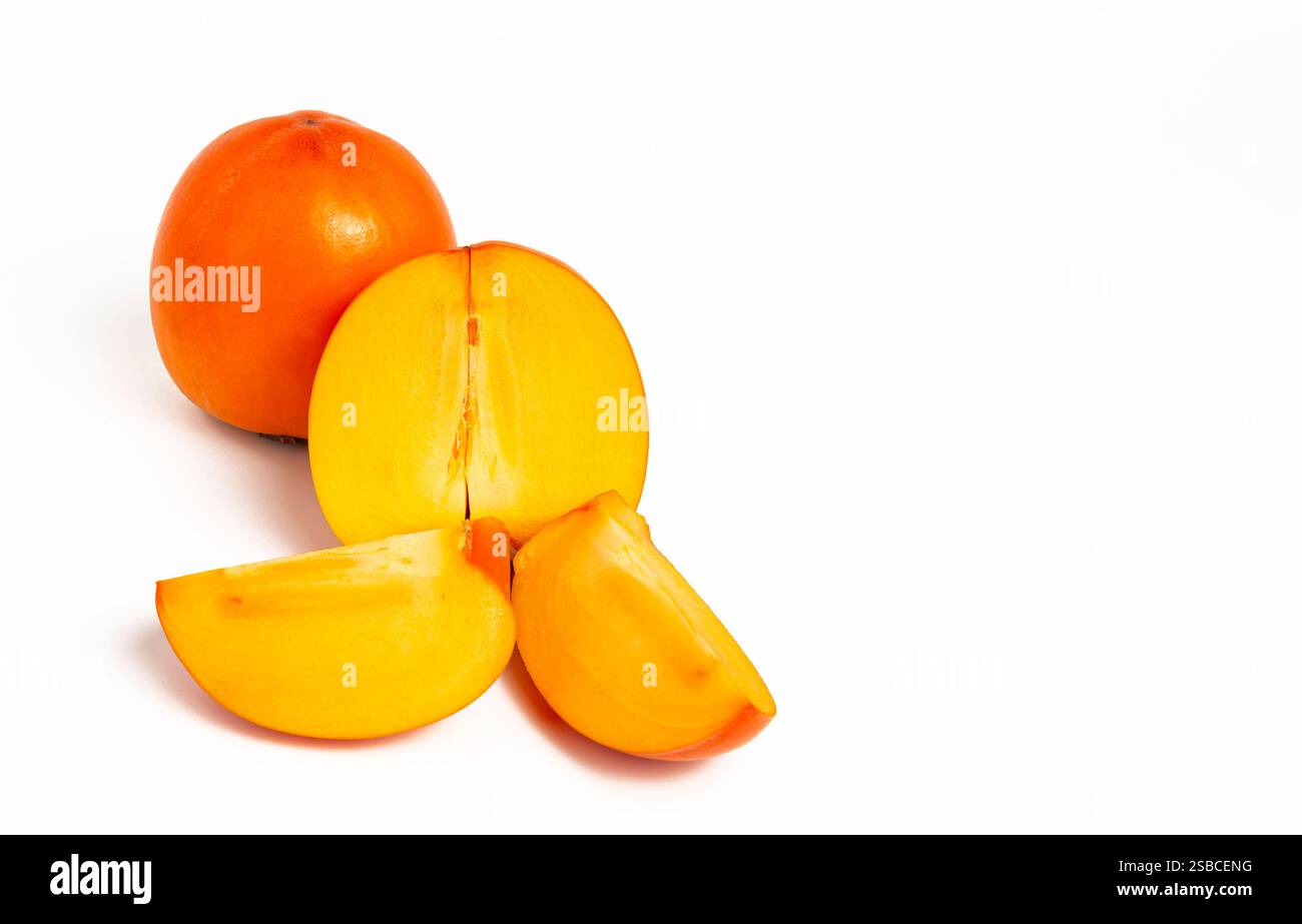 Close up fresh orange organic ripe Fuyu Persimmons fruits with sliced ...