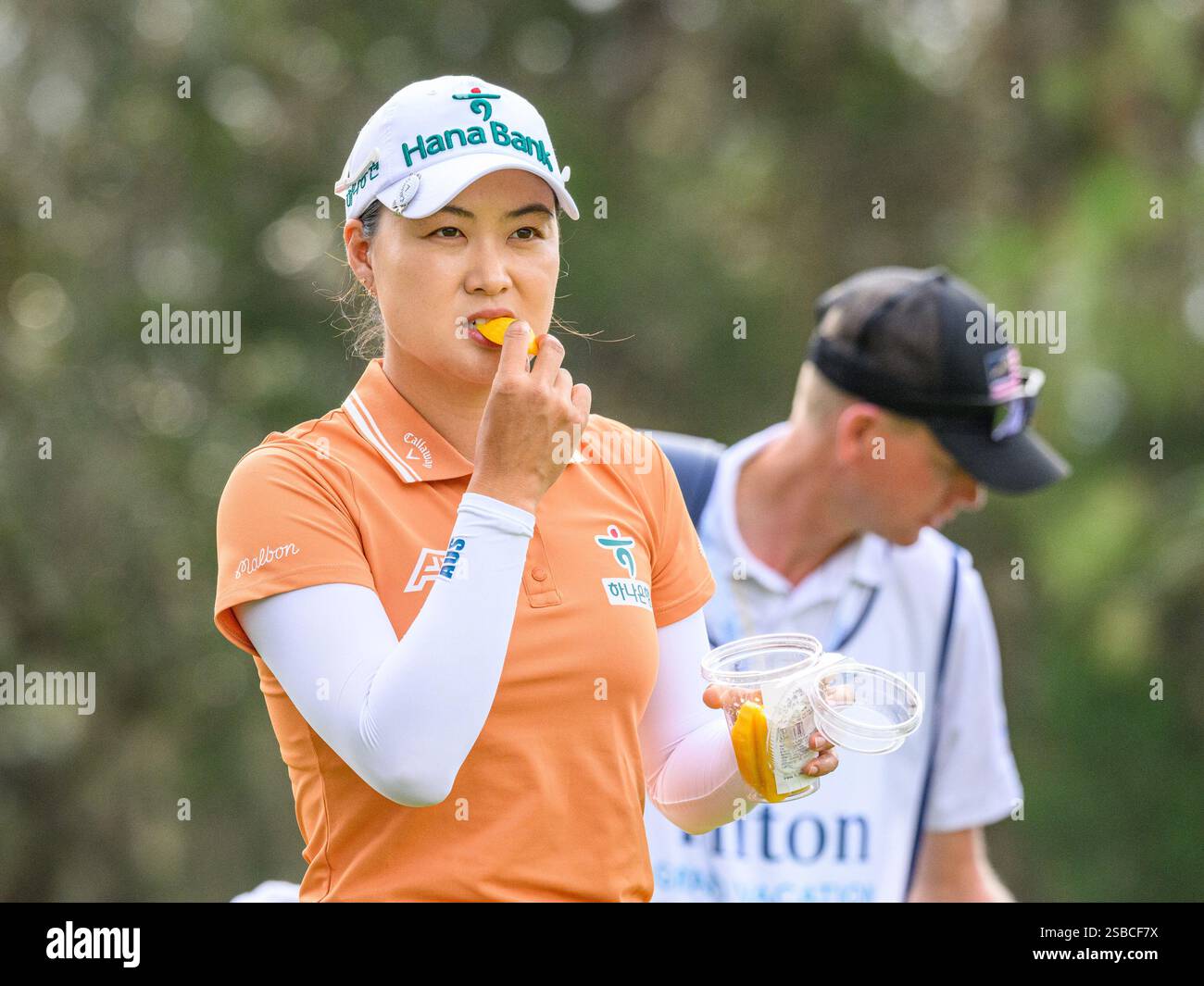 Orlando, FL, USA. 2nd Feb, 2025. Mingee Lee of Australia eats a snack ...