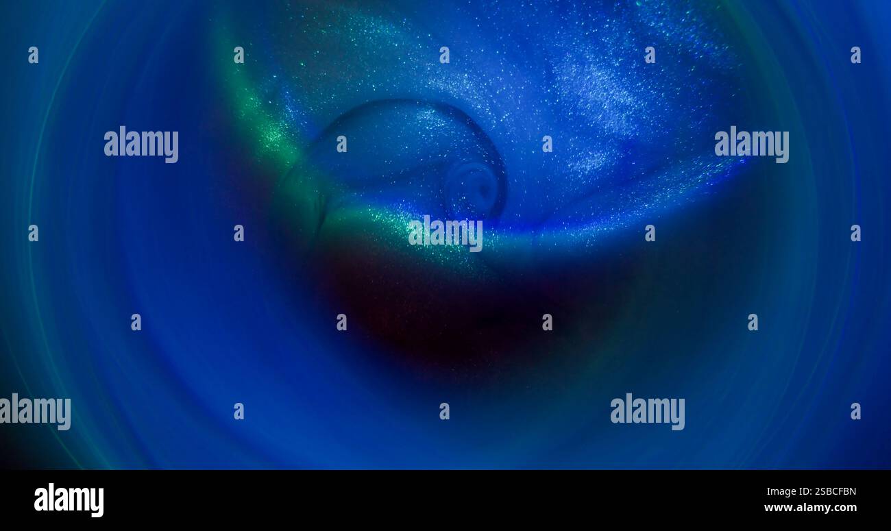 Glitter flow. Paint explosion. Glossy smoke blue violet green sparkling ...