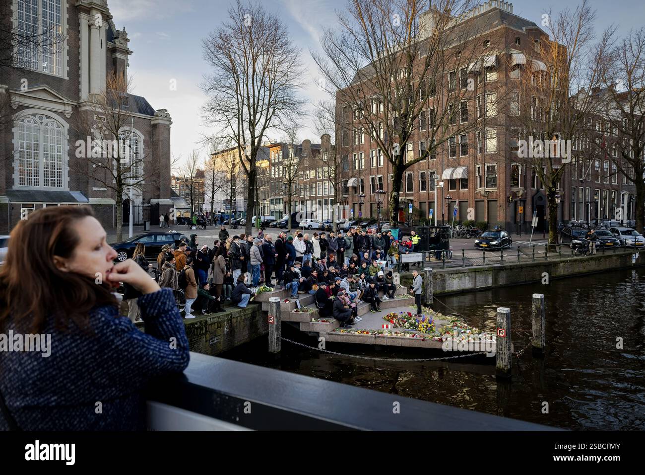 AMSTERDAM - Relatives and friends hold a moment of silence during a ...