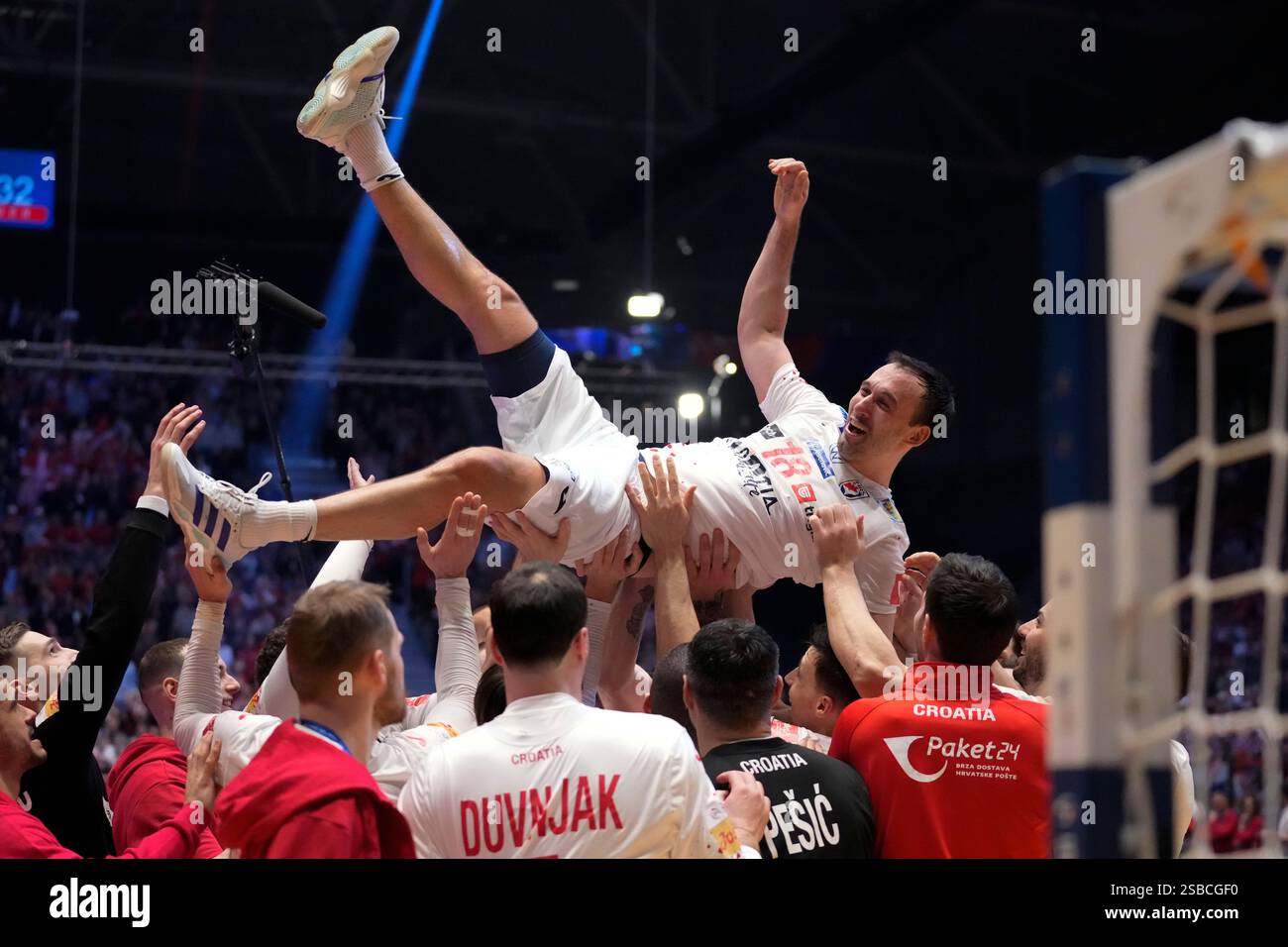Croat players toss Igor Karacic as they celebrate second place after ...