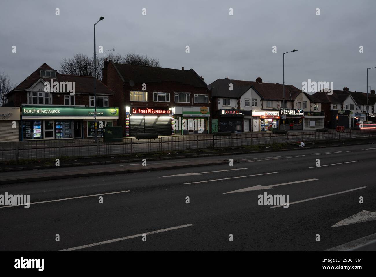 Shops on the A45 road, early morning, Sheldon, West Midlands, England ...