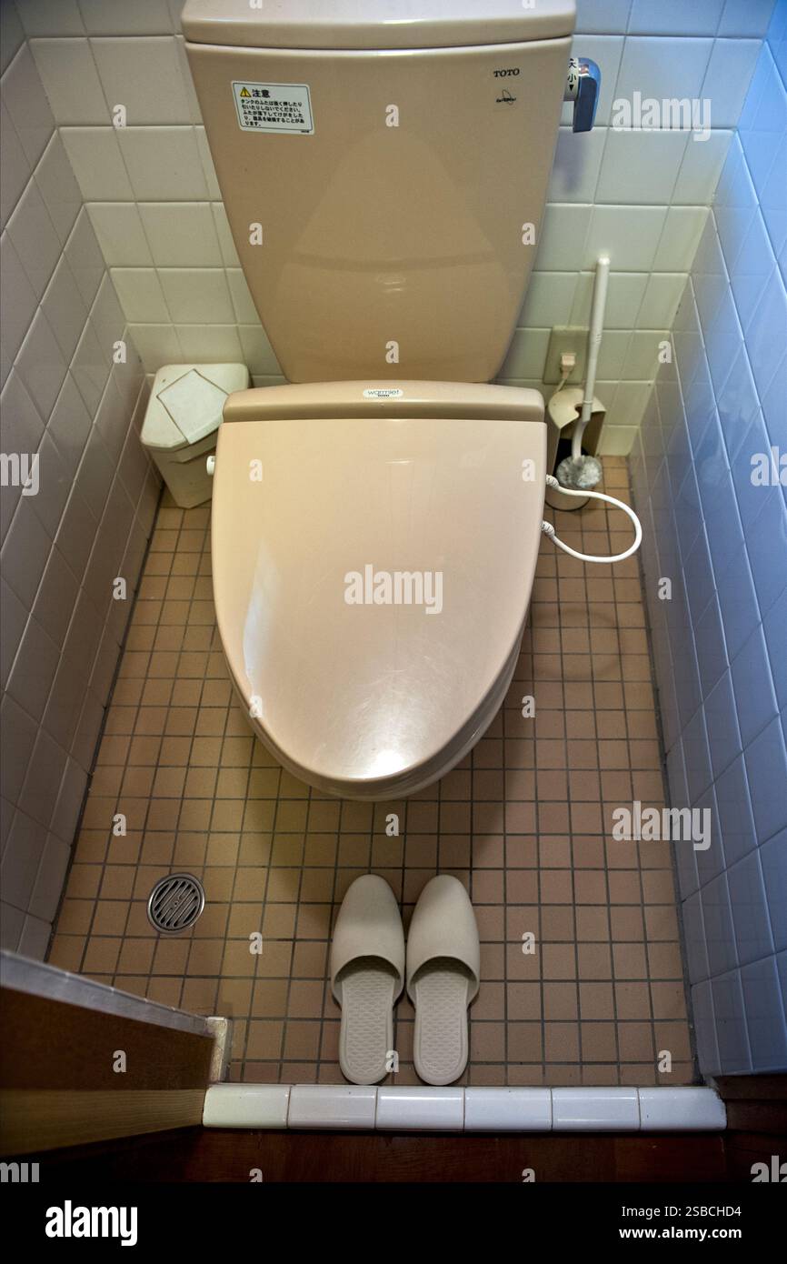 Removing shoes or house slippers and changing to toilet slippers is a ...