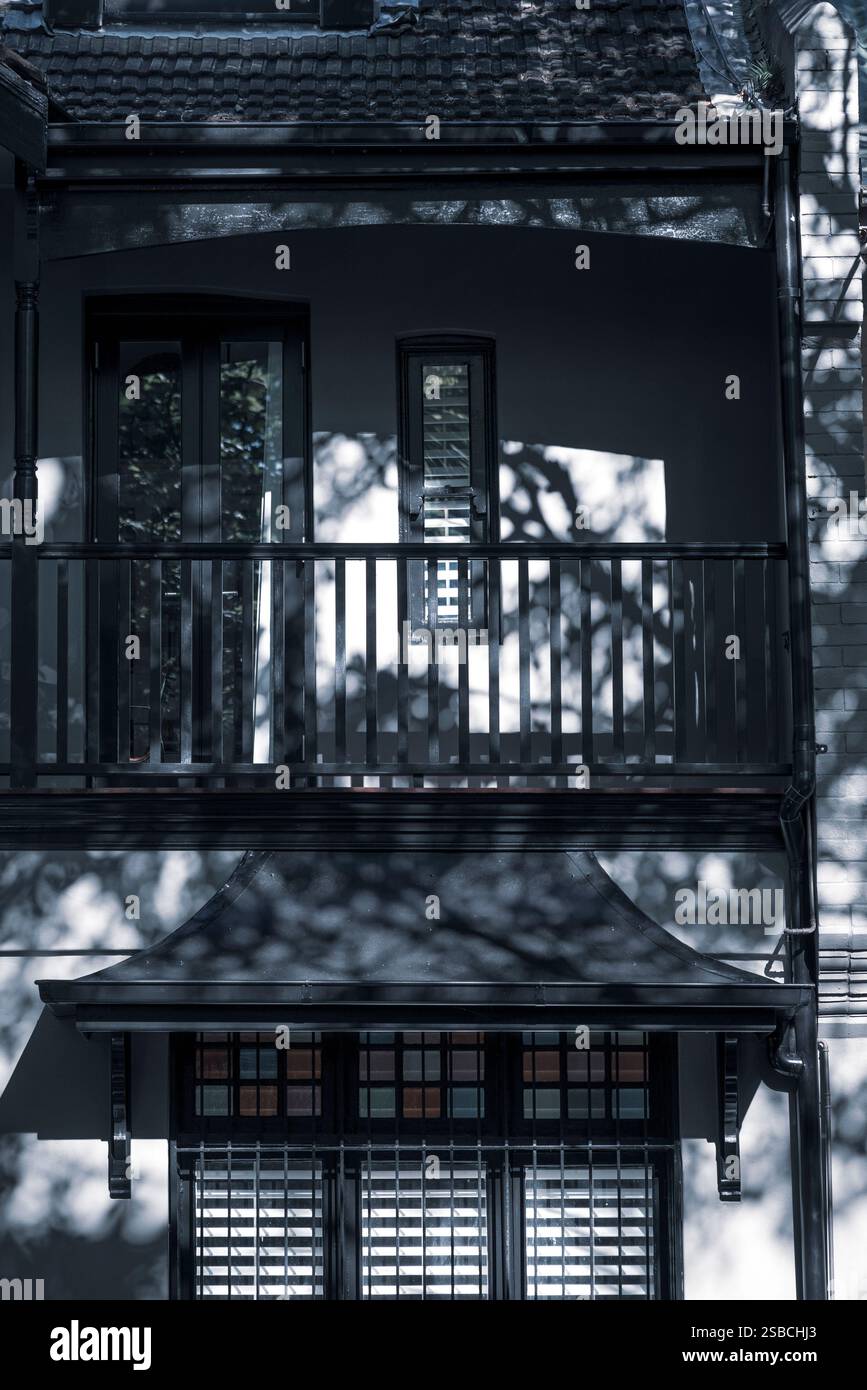 Residential Victorian-era house adorned with ornamental iron lacework ...