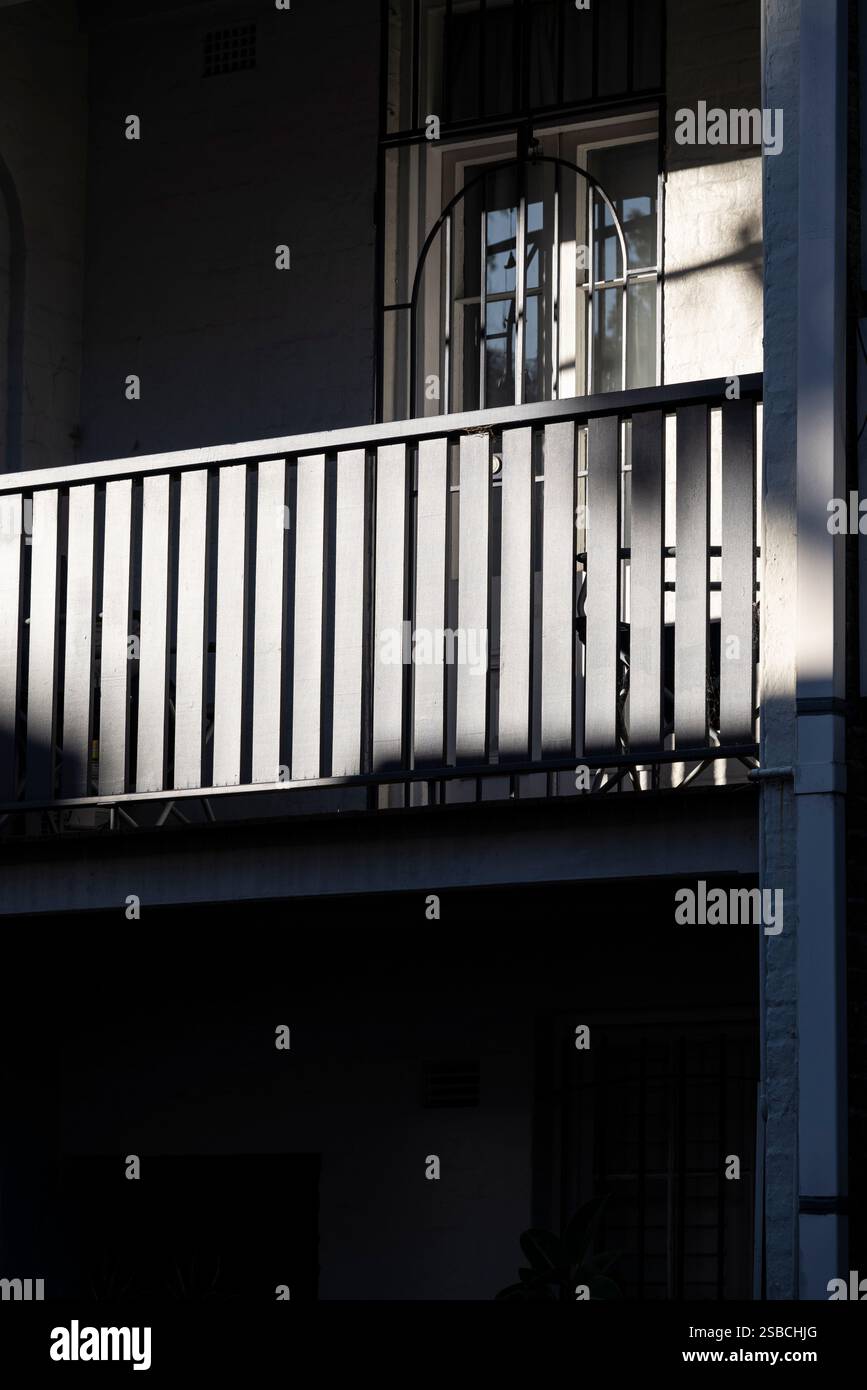 Residential Victorian-era house adorned with ornamental iron lacework ...