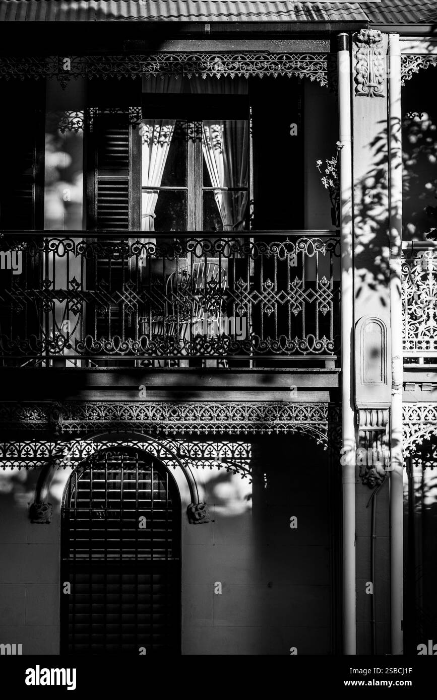 Residential Victorian-era house adorned with ornamental iron lacework ...