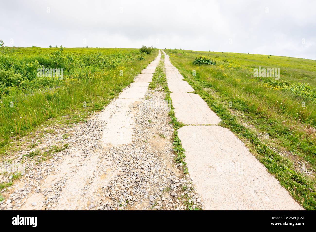 old concrete mountain road. highland landscape. path through smooth ...