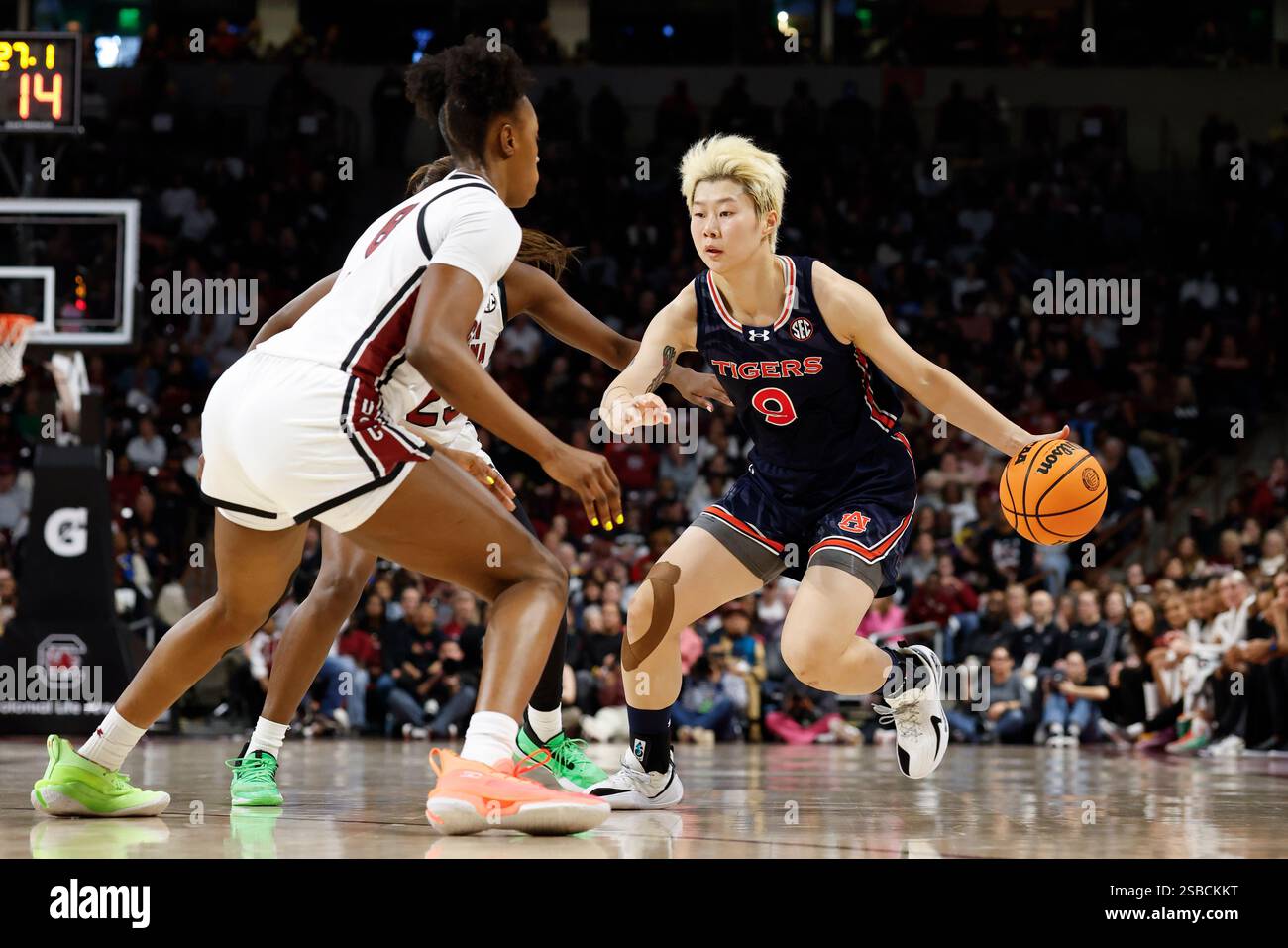 Auburn guard Yuting Deng, right, drives against South Carolina forward ...