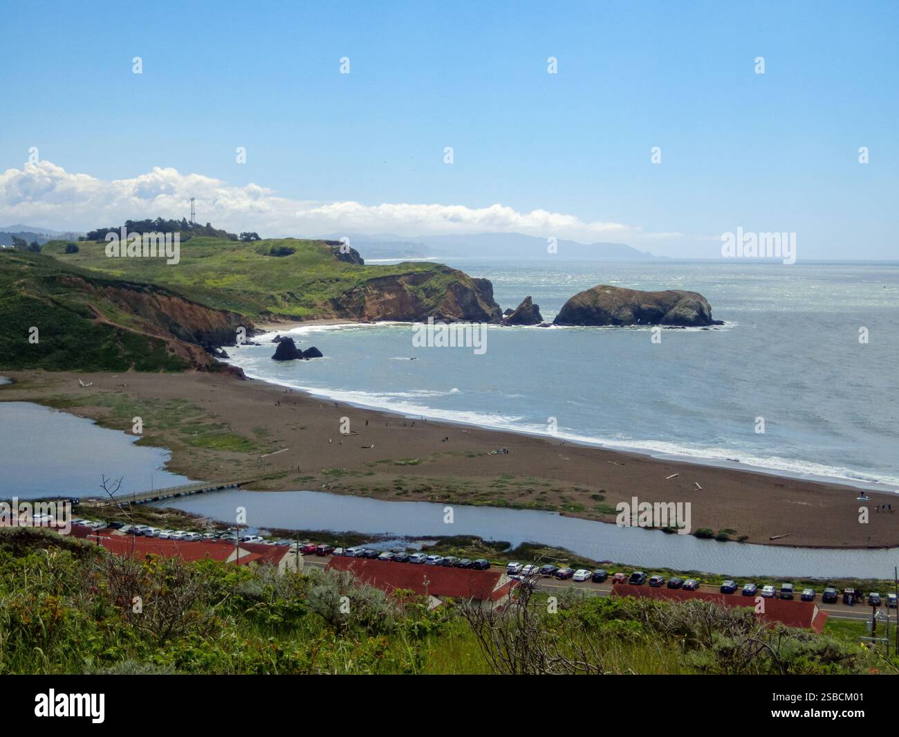 Rodeo Beach and rocky shoreline in Marin Headlands on clear blue sky ...