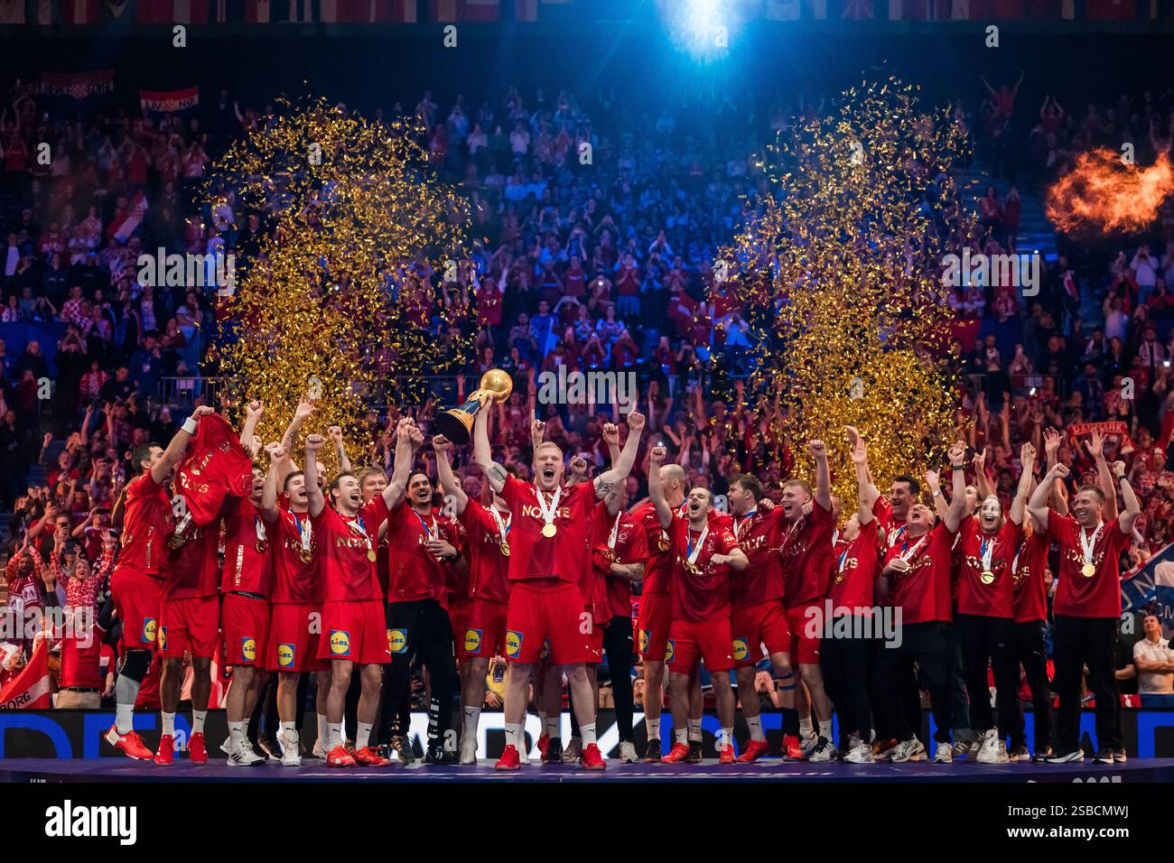 Players of, Denmark. , . celebrate with the trophy after the 2025 IHF ...