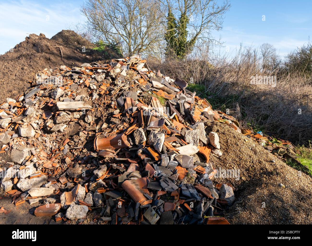 A pile of demolition waste fly tipped in the countryside Stock Photo ...