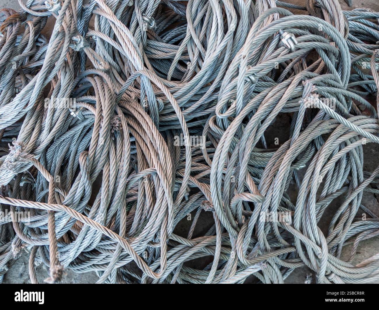 pile of steel cable closeup background Stock Photo - Alamy