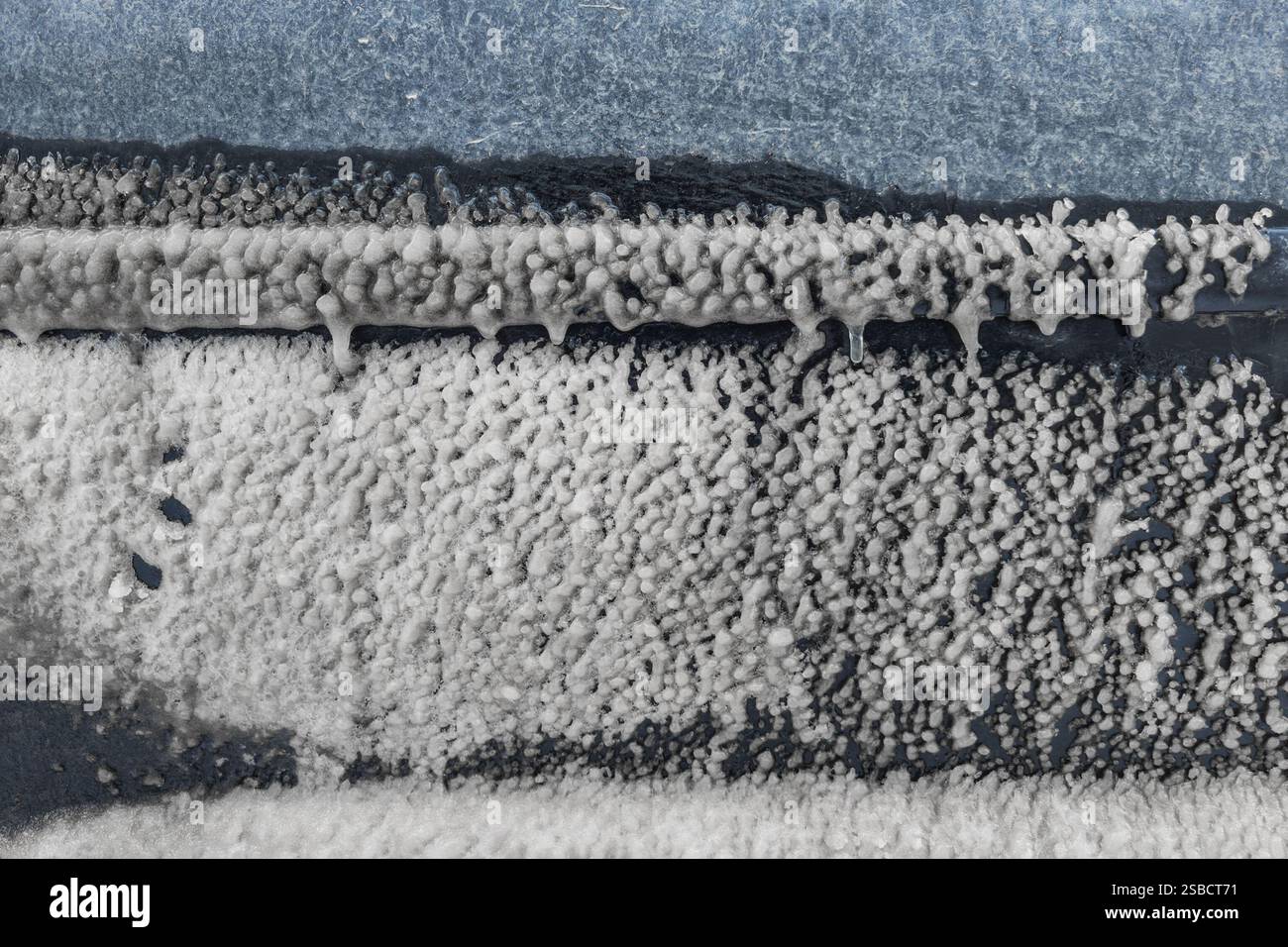 ice layer formed on car door at winter freezing rain on the road Stock ...