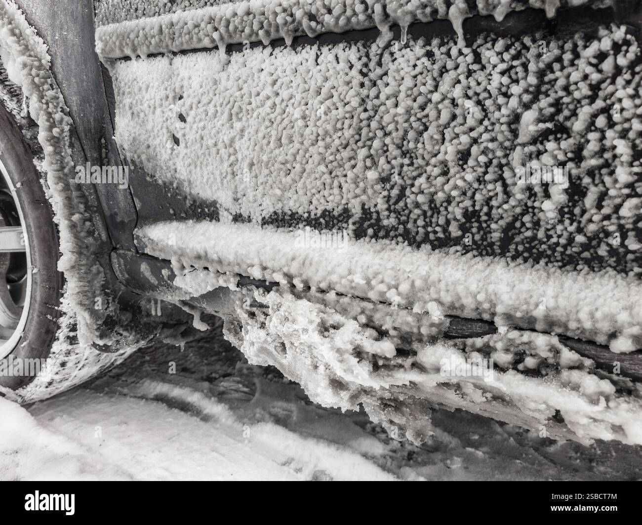 ice layer formed on car door at winter freezing rain on the road Stock ...