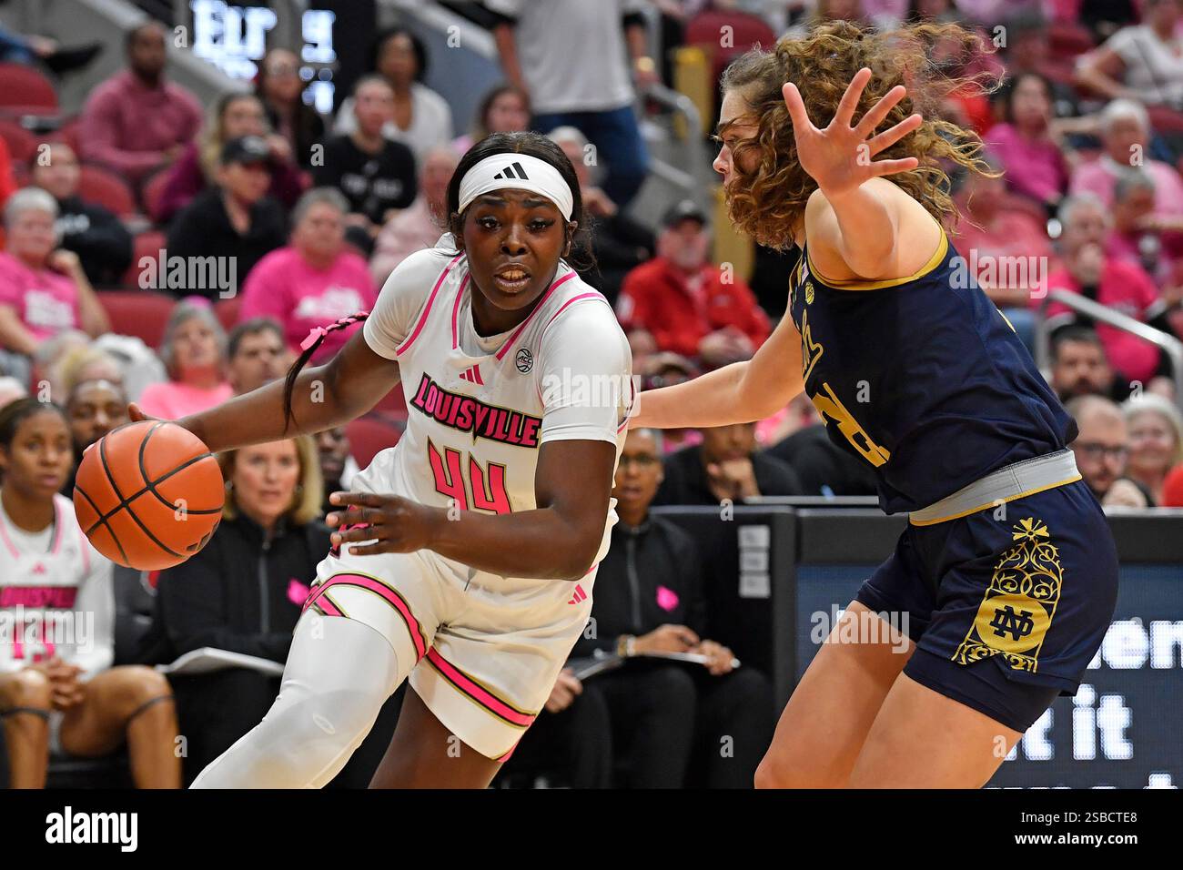 Louisville forward Olivia Cochran (44) drives to the basket against ...