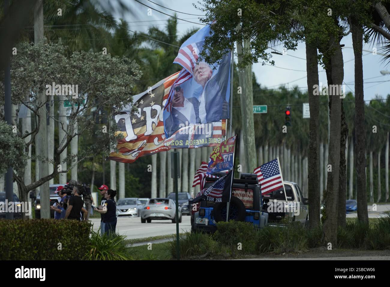 Supporters of President Donald Trump display flags outside Mar-a-Lago ...