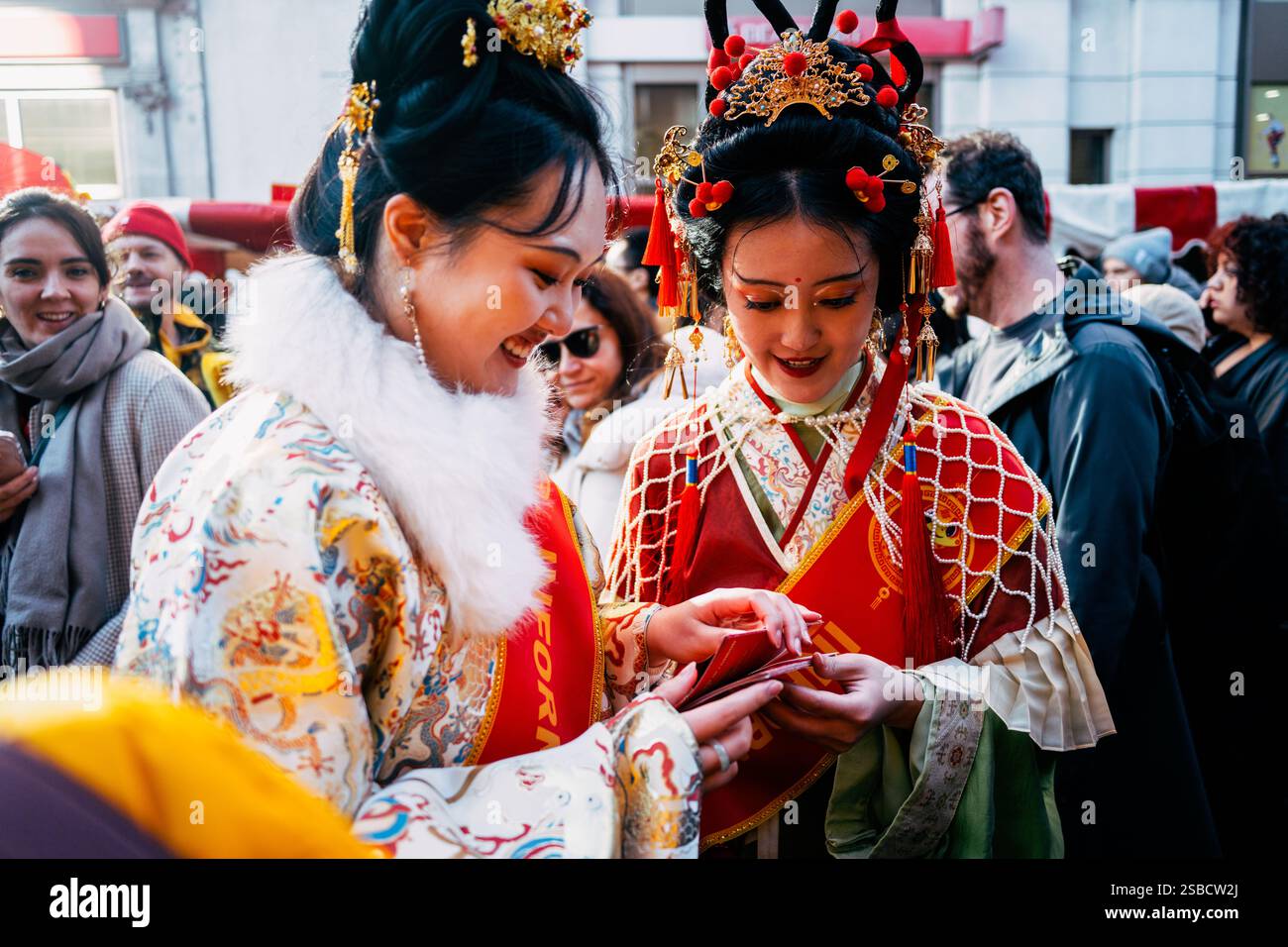 Women in Traditional Attire Exchanging Items During the Chinese New ...