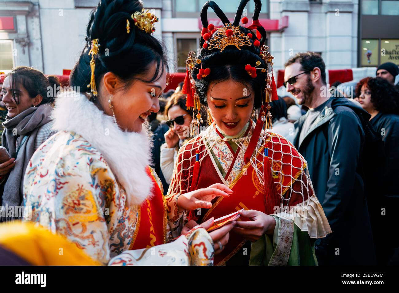 Women in Traditional Attire Exchanging Items During the Chinese New ...
