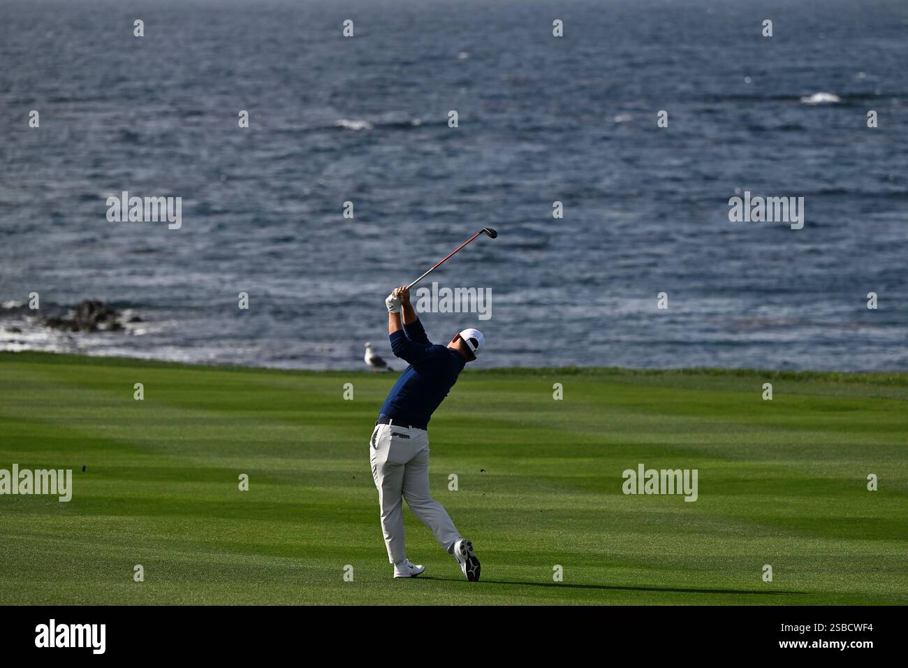 Tom Kim hits from the sixth fairway at Pebble Beach Golf Links during ...