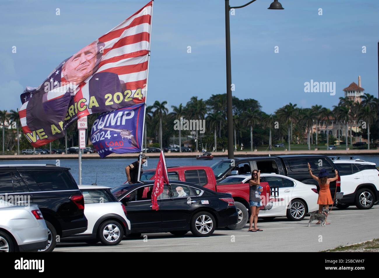Supporters of President Donald Trump display flags near Mar-a-Lago ...
