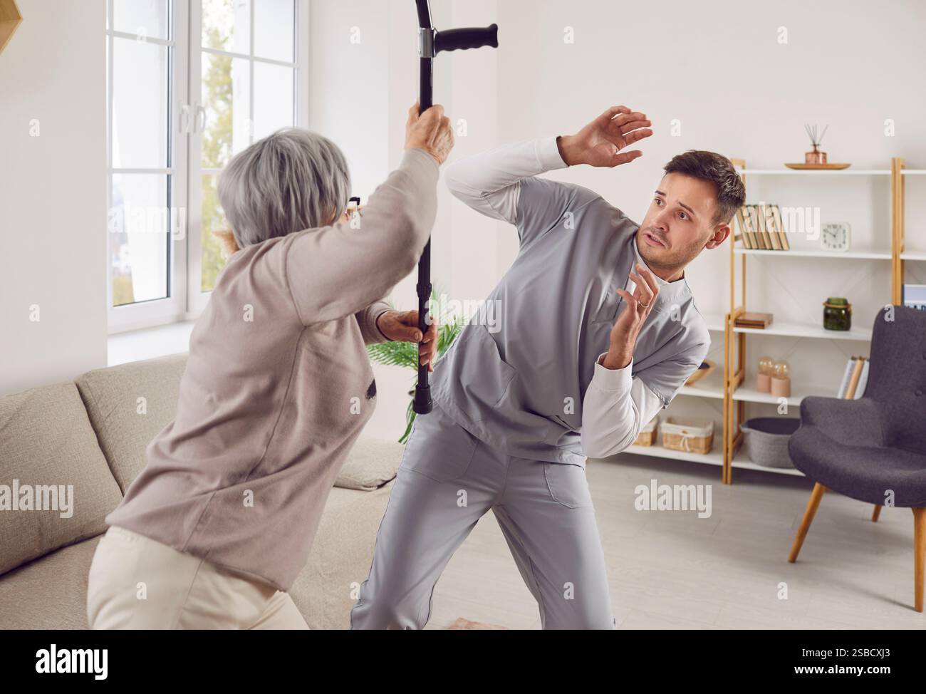 Angry Elderly Patient Confronts Doctor or Nurse Stock Photo - Alamy
