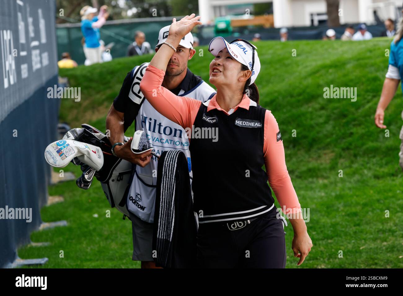 A Lim Kim waves to crowd after finishing the ninth hole during the ...