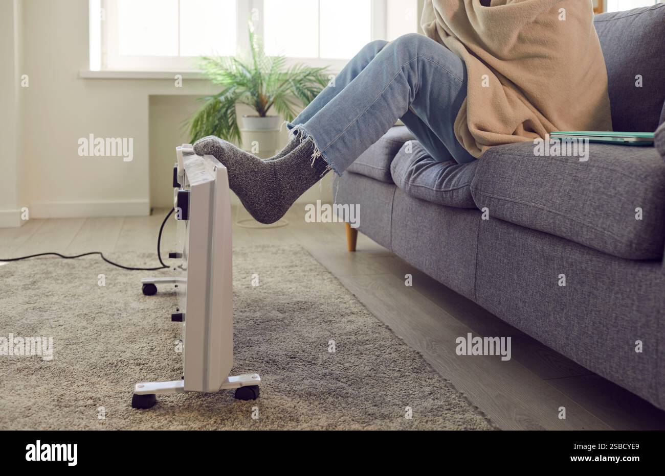 Man lives in house without central heating and warms his feet by ...