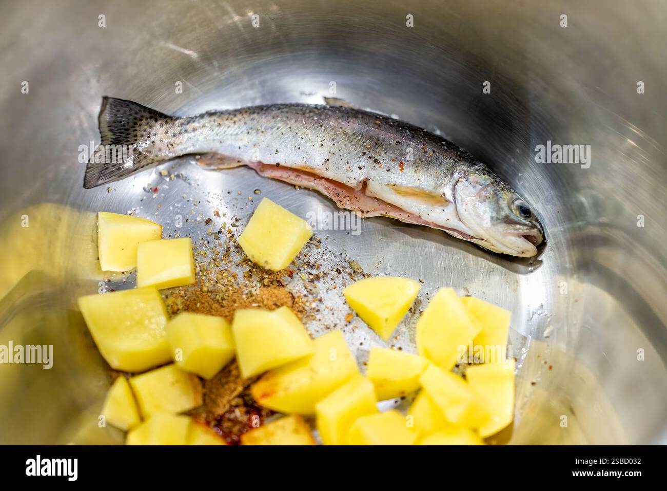 Potatoes and rainbow trout fish animal wild raw uncooked whole ...