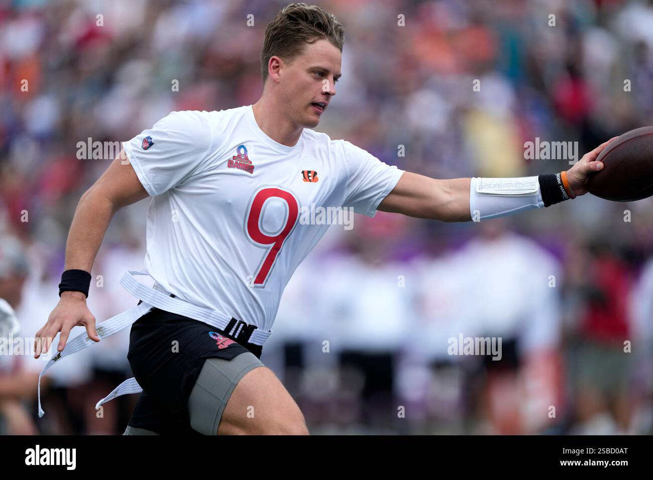 AFC quarterback Joe Burrow (9), of the Cincinnati Bengals, reaches the ...