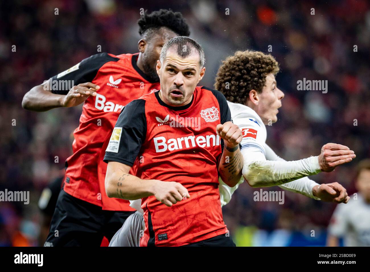 Leverkusen, Deutschland. 02nd Feb, 2025. Granit Xhaka (Bayer 04 Leverkusen, 34), Edmond Tapsoba ...