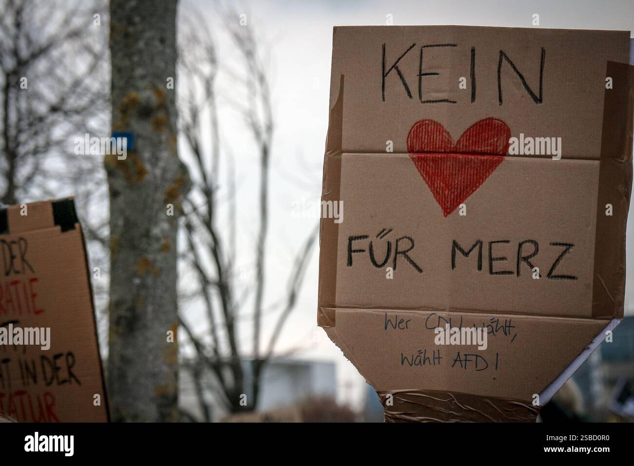 Berlin, Germany - February 2, 2025: Protest sign reads "Kein [Herz] für ...